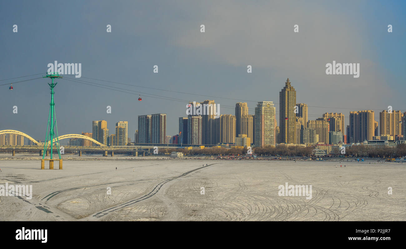 Harbin, China - Feb 22, 2018. Cityscape with ice river in Harbin, China ...