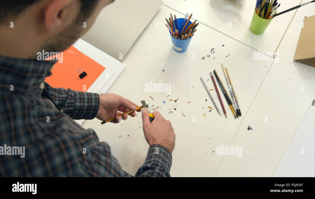 Man sharpening pencil hi-res stock photography and images - Alamy