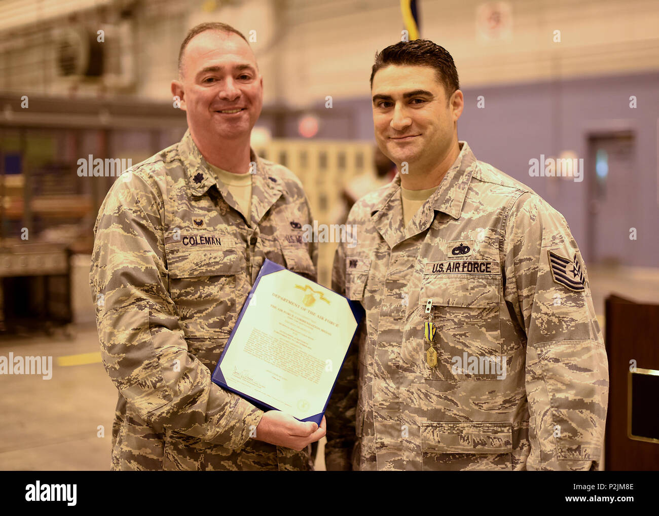 Lieutenant Col. Timothy Coleman presents Technical Sgt. Tyson Wong ...