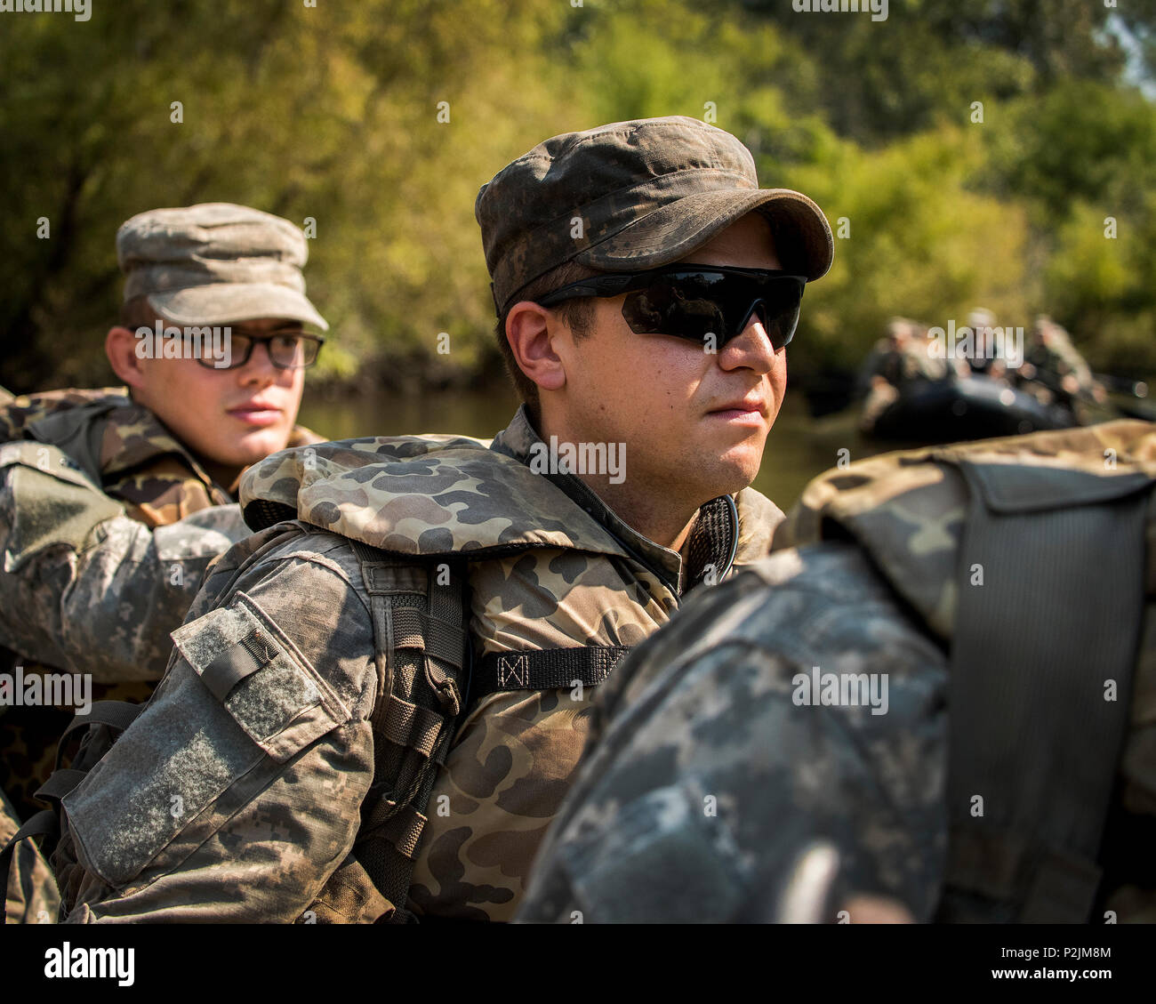 6th Ranger Training Battalion Soldiers paddle down river moving toward ...