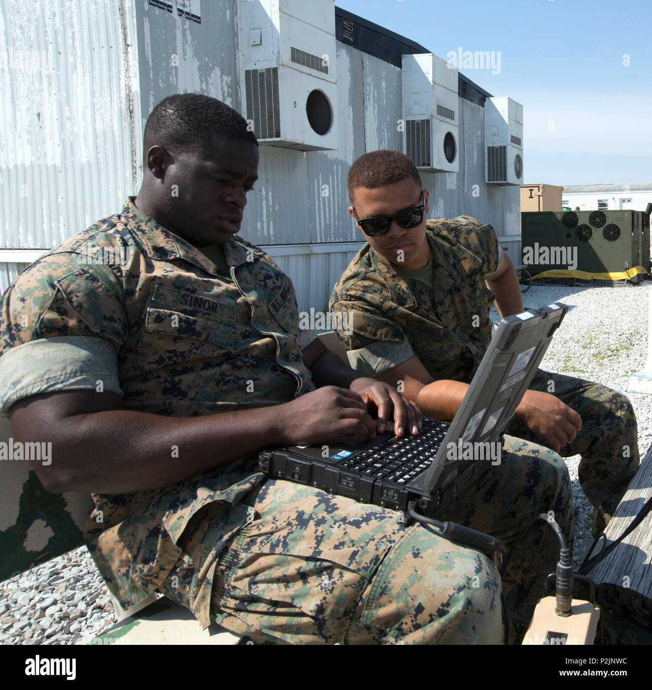 Cpl. Alex K. Sinor and Cpl. Obassi H. Bholai from 24th Marine ...