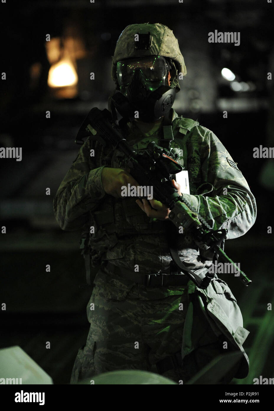 A member of the 509th Security Forces Squadron (SFS) secures Air Force ...