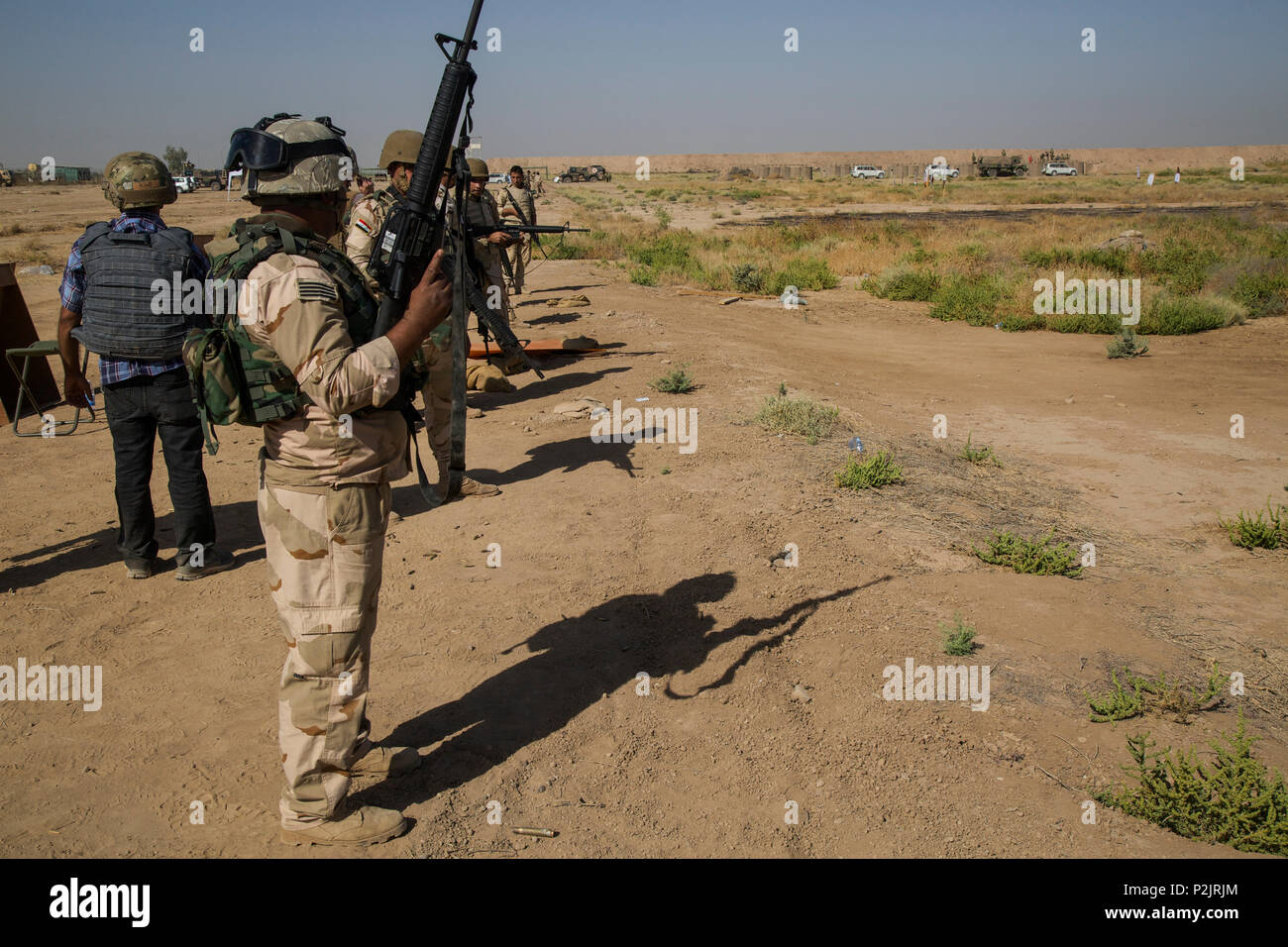 Iraqi soldiers assigned to the 75th Iraqi Army Brigade prepare to fire ...