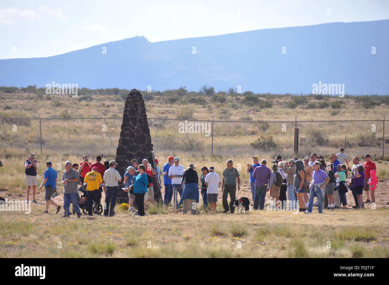 Visitors crowd around the obelisk that marks ground zero during a ...
