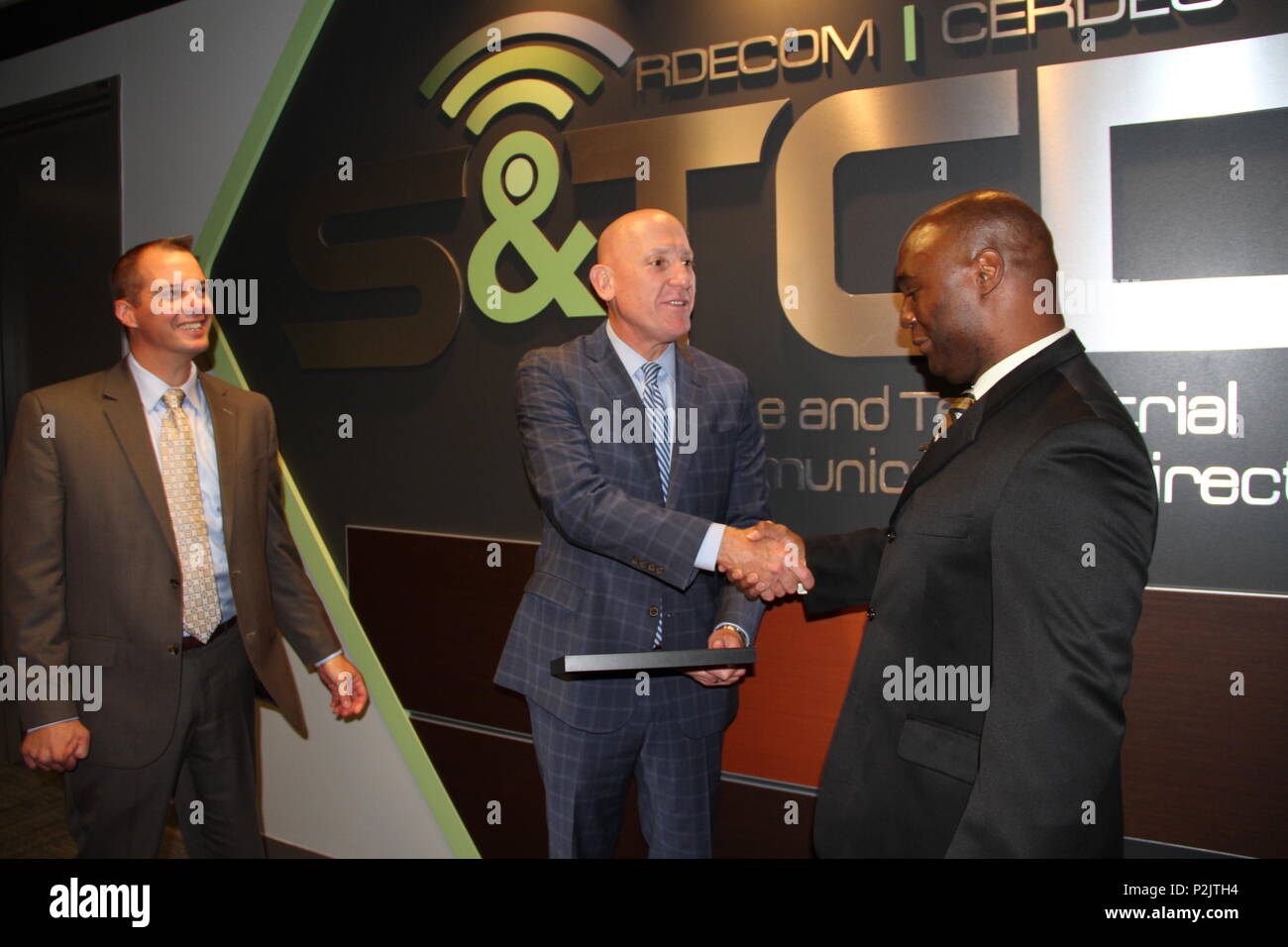 Dr. Maurice M. McKinney, director, UCDSMO, presents S&TCD’s John ...