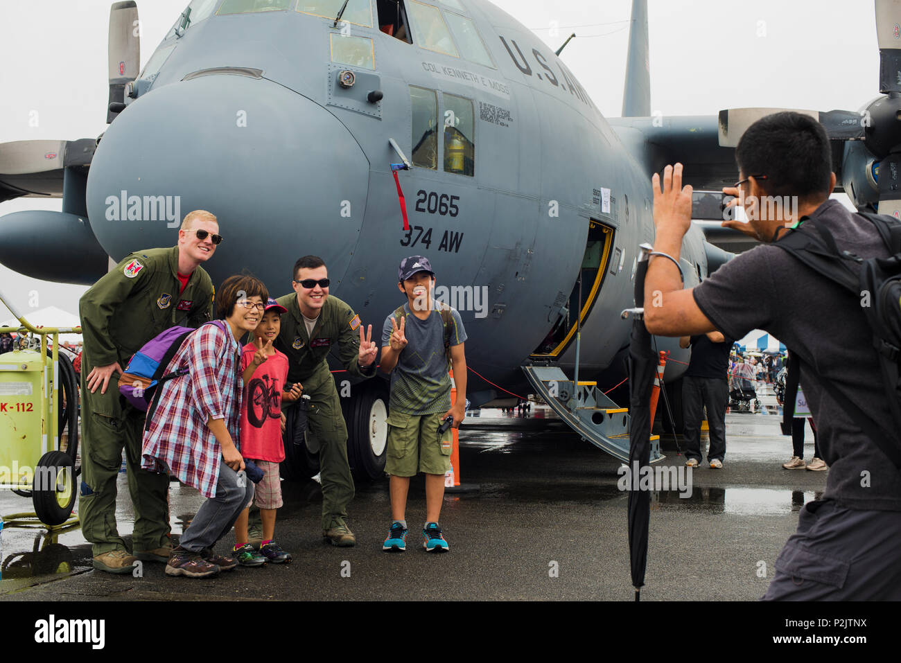 USAF flight crew pose for photo with local family during the Friendship ...