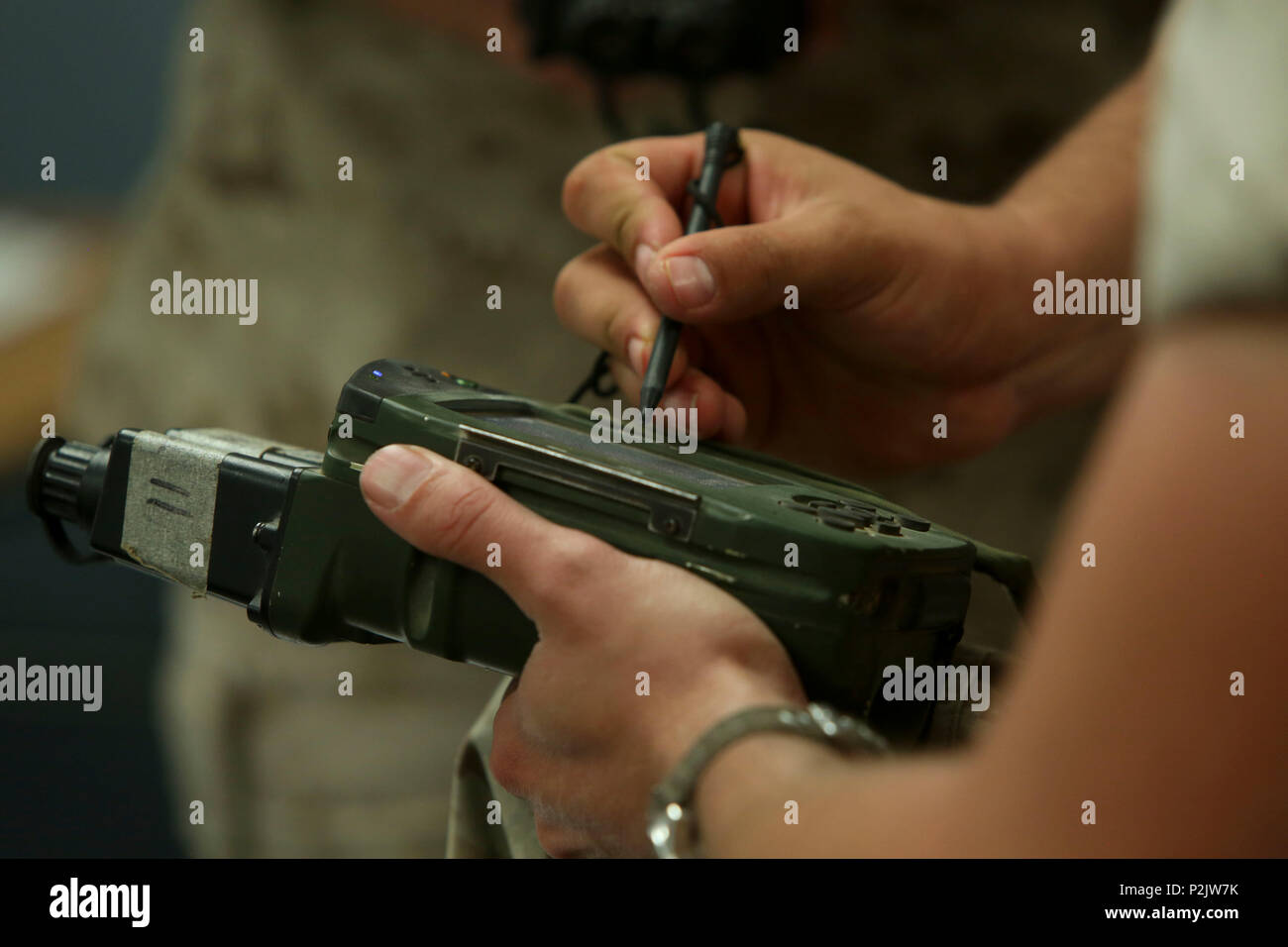 Two Marines operate the ¬¬¬¬Ruggedized Personal Digital Assistant ...