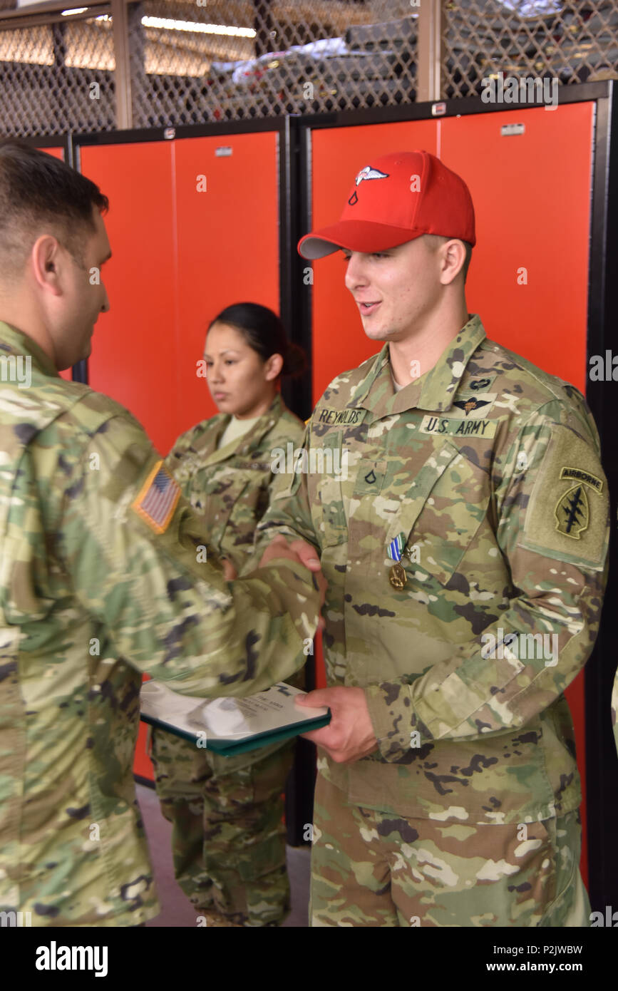 Private Frist Class Clayton Reynolds, a parachute rigger assigned to ...