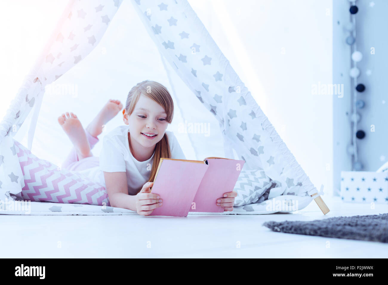 Schoolgirl Lying On Floor Reading High Resolution Stock Photography and ...