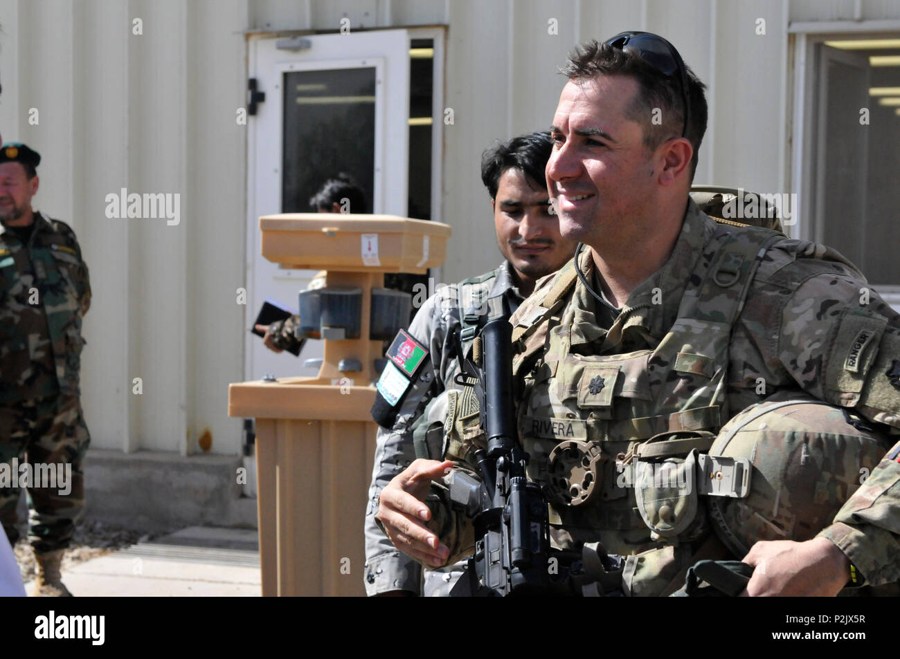 Lt. Col. Jose Rivera prepares to greet his Afghan counterpart during ...