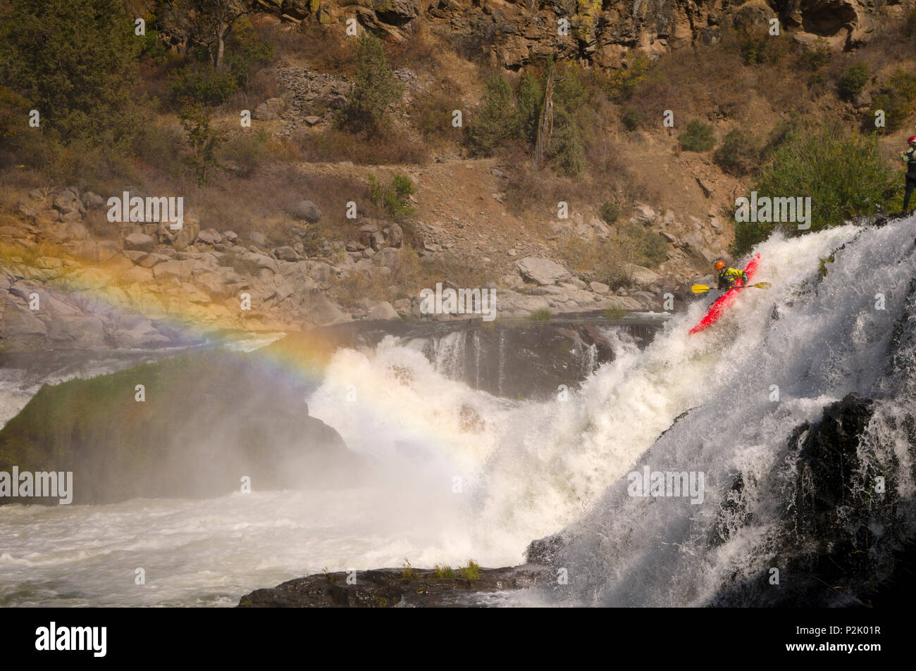 Kayaking over a waterfall on the pit river in Northern California ...