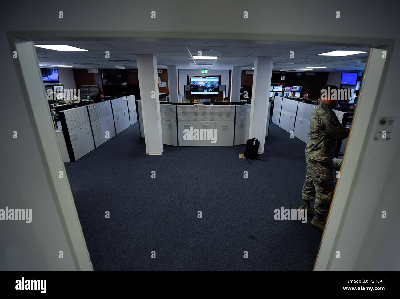 U.S. Airmen with the 21st Operational Weather Squadron monitor the ...