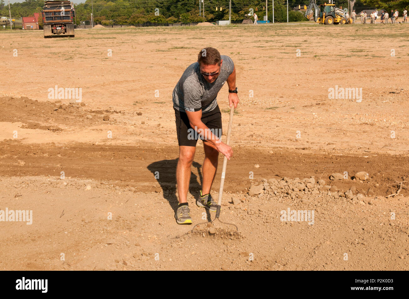 Airmen work on construction of a new running track at the 117th Air ...
