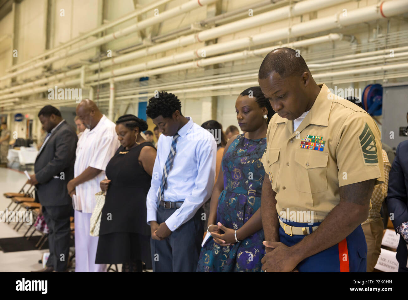 U.S. Marine Corps Master Sgt. Anthony Colston stands beside his family ...