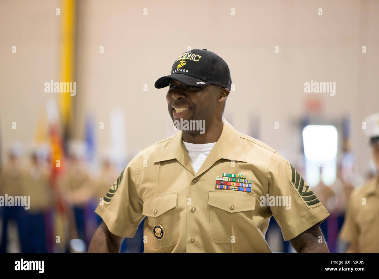 U.S. Marine Corps Master Sgt. Anthony Colston wears a hat gifted to him ...