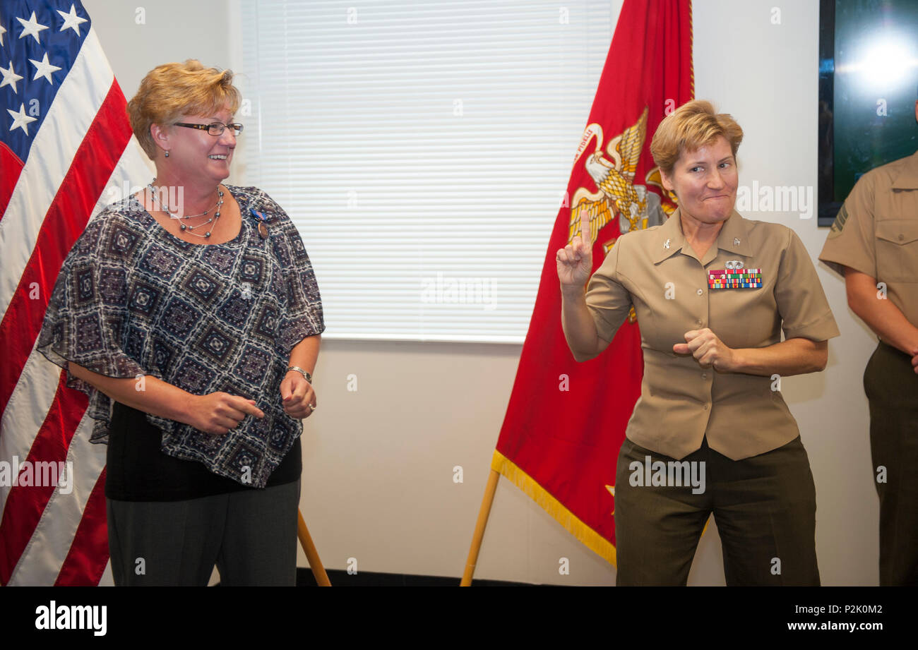 U.S. Marines Corps Col. Jennifer E. Carter, right, shares a story about ...