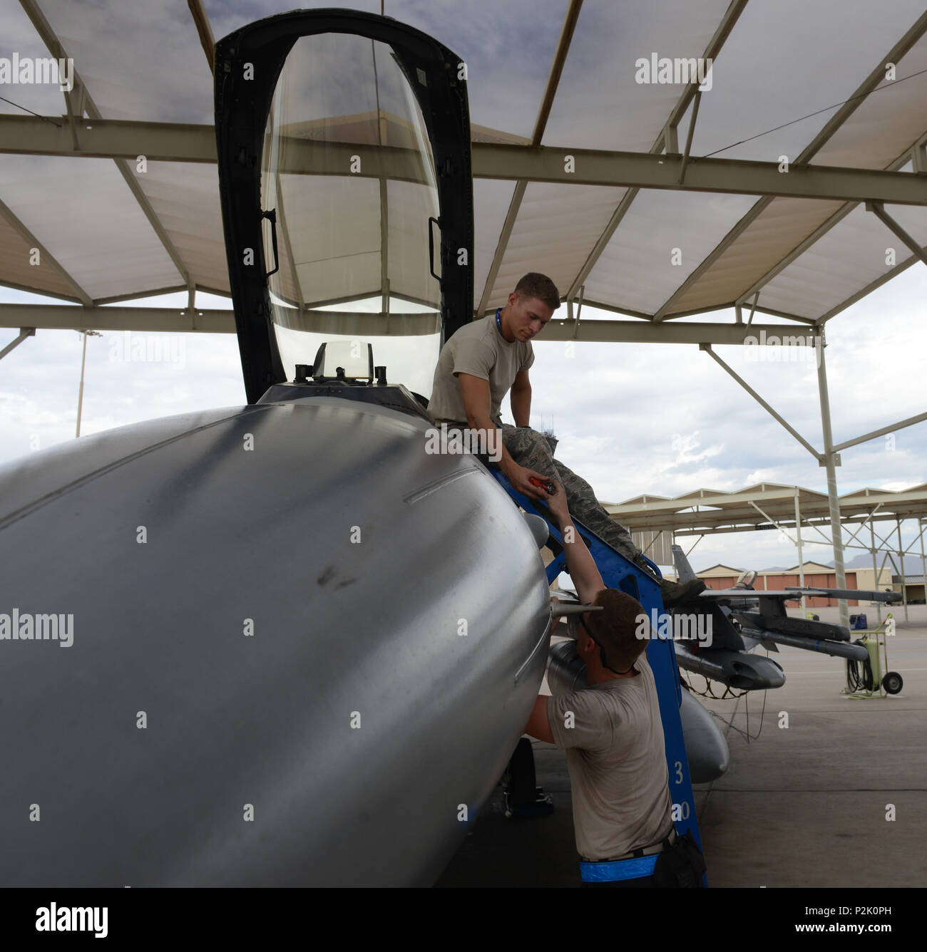 1st Lt. Taylor Absher, 309th Fighter Squadron fighter pilot, hands ...