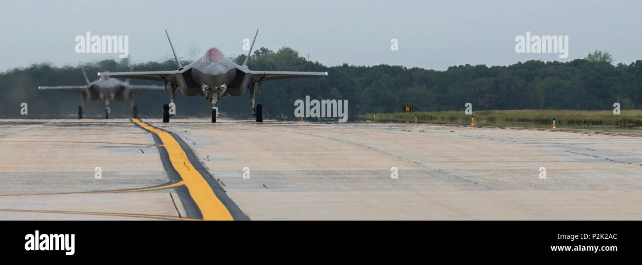 Two F-35 Lightning II aircraft taxi down the flight line at Joint Base ...