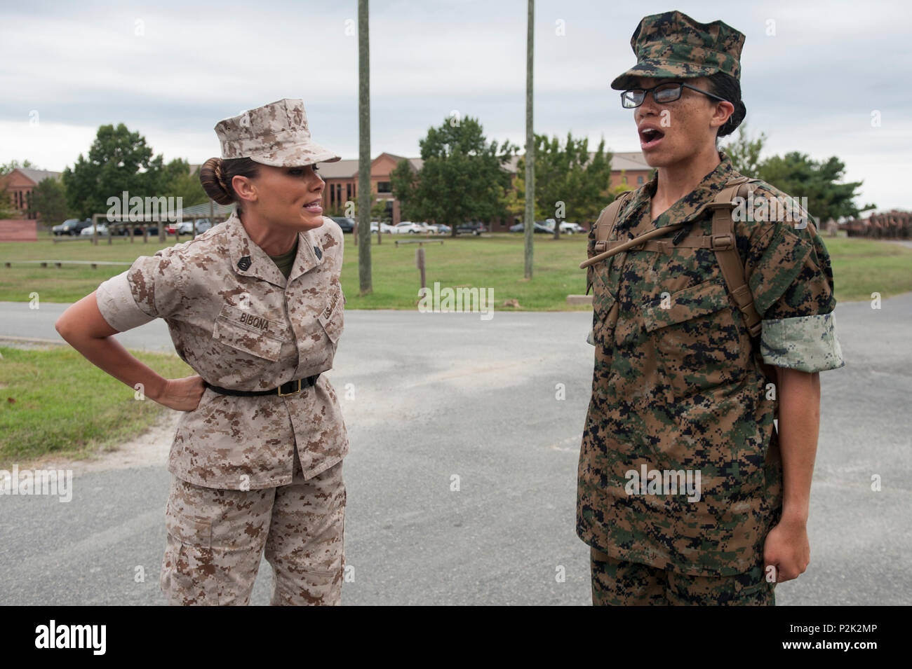 U.S. Marine Drill Instructor Gunnery Sgt. Leigh Bibona teaches a new ...