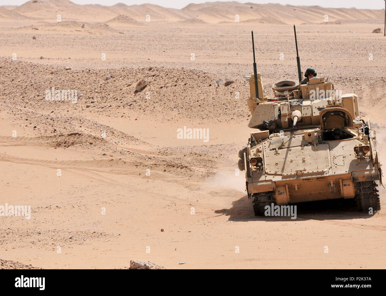 Troopers with the 2nd Squadron 13th Cavalry Regiment maneuver a Bradley ...