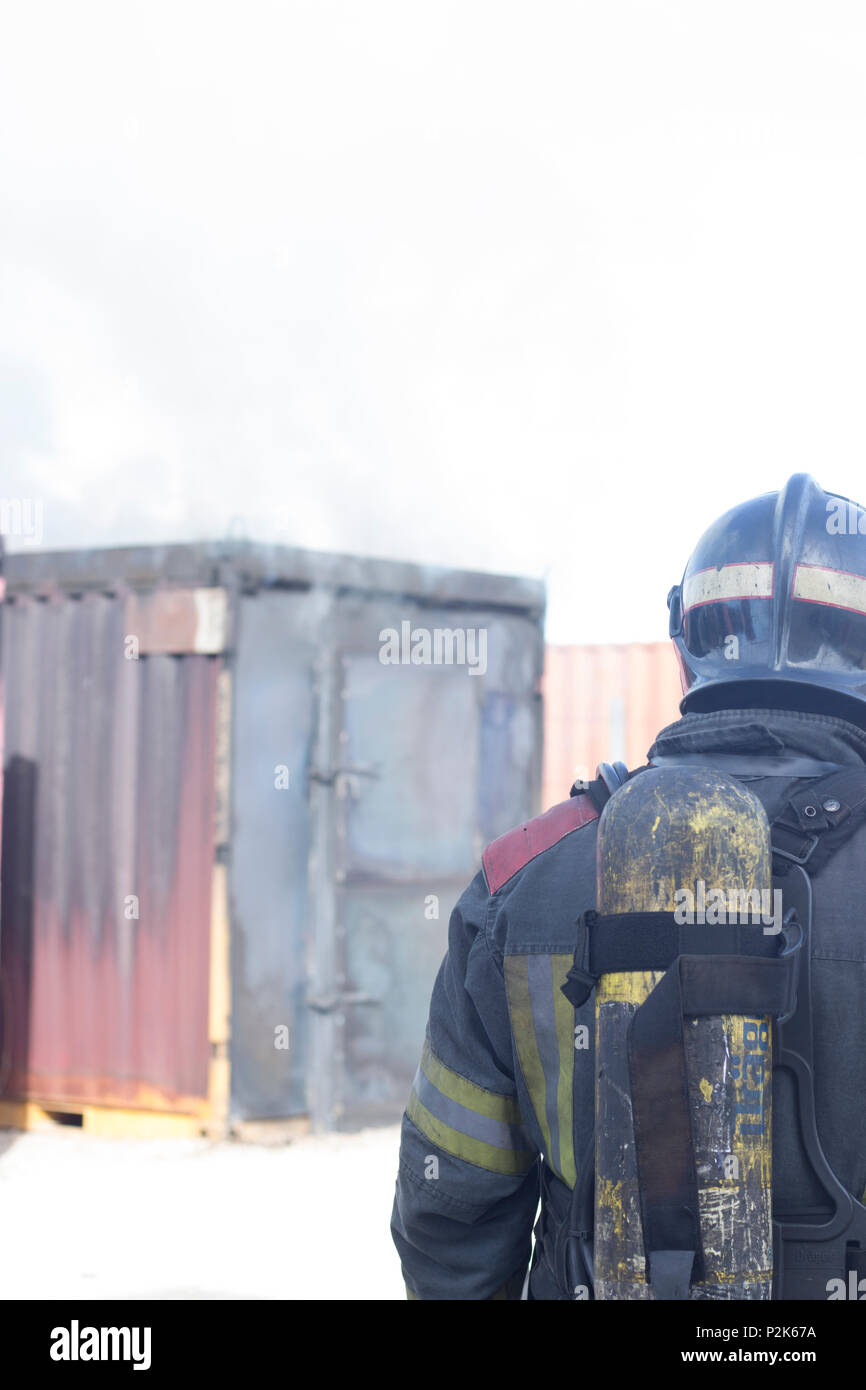 Firefighter putting out fire training station extinguisher backdraft ...