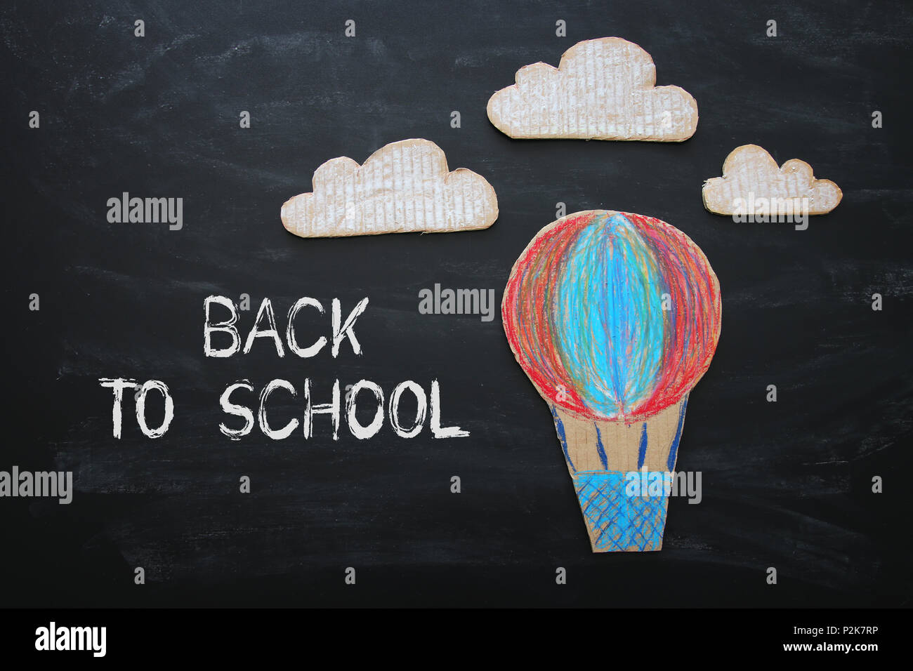 Back to school concept. Top view image of handmade hot air baloon and ...