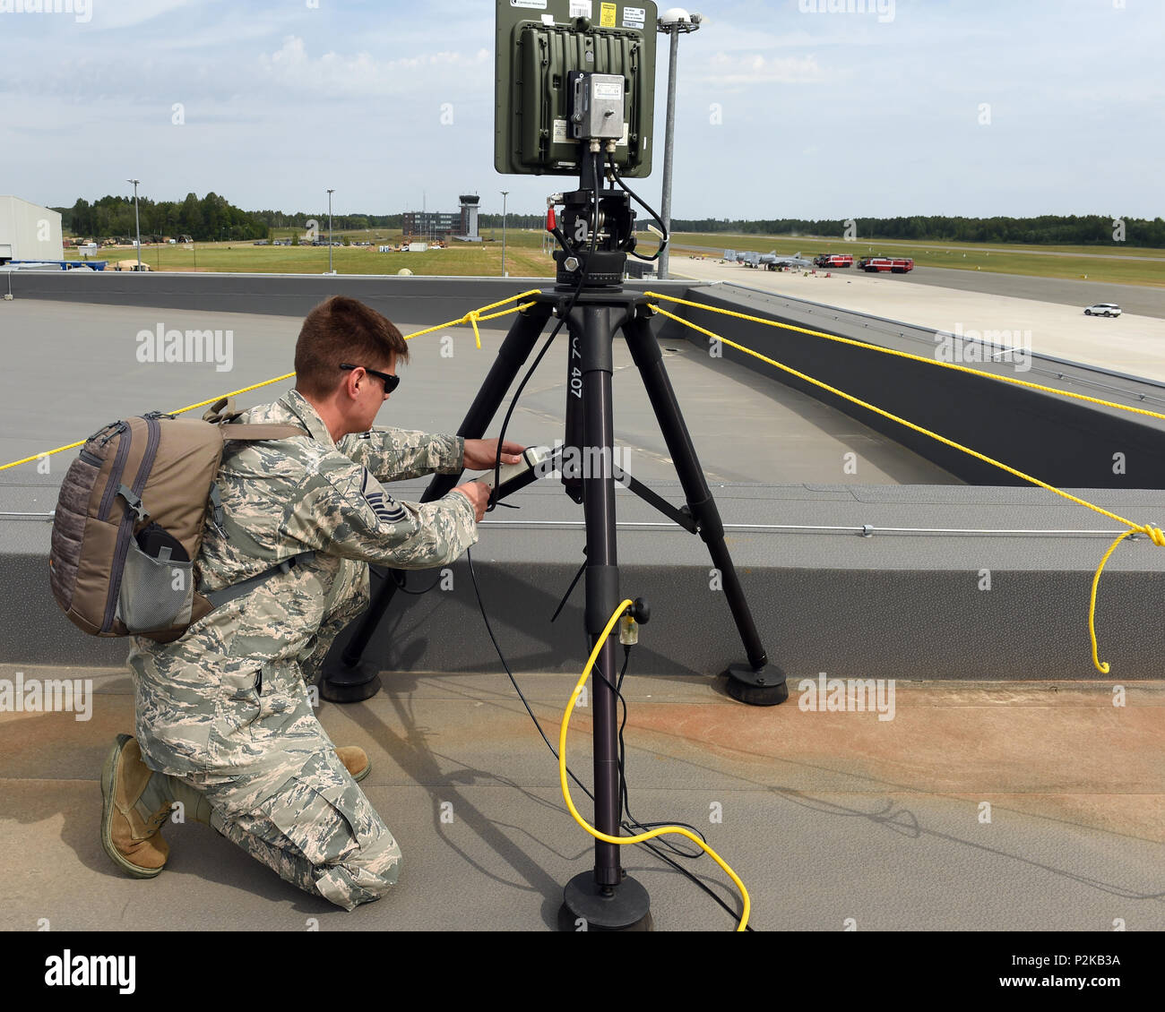 LIELVARDE AIR BASE, Latvia-- Master Sgt. Steven Haven aims a radio ...