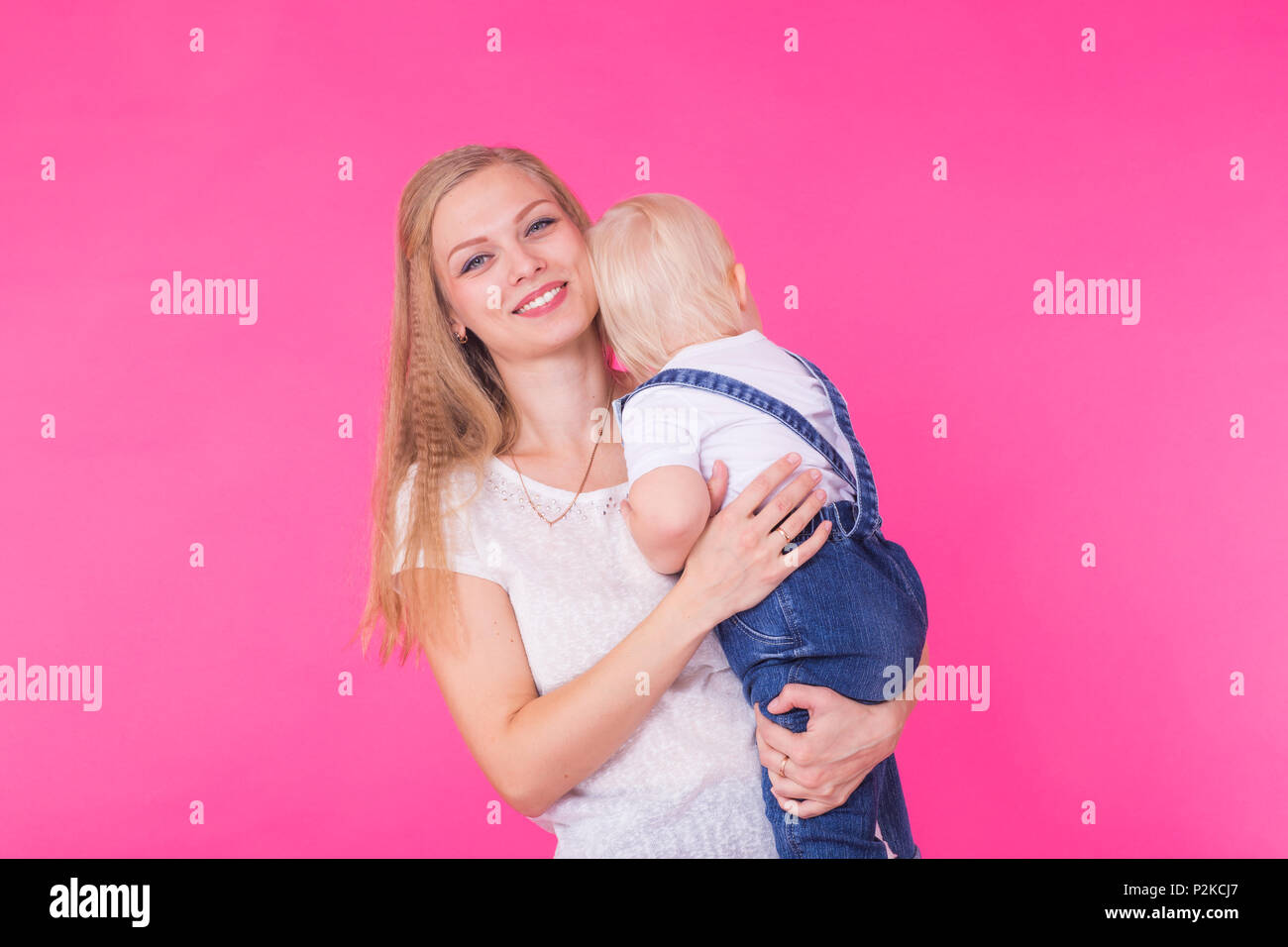 Funny family on pink background. Mother and her daughter girl. Mom and ...
