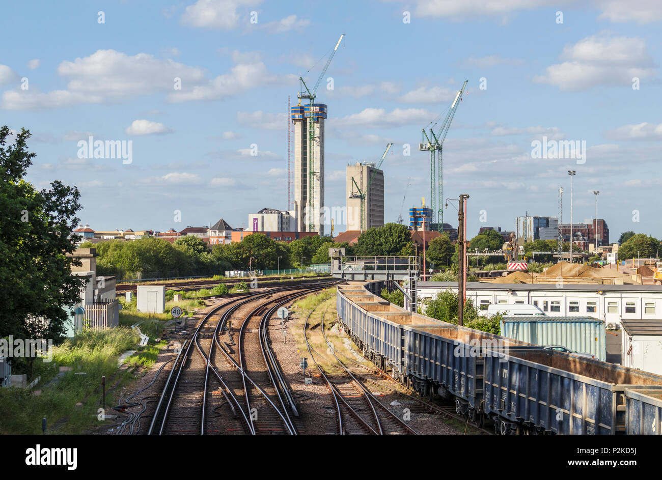The changing skyline of Woking, Surrey: railway tracks lead to tower ...