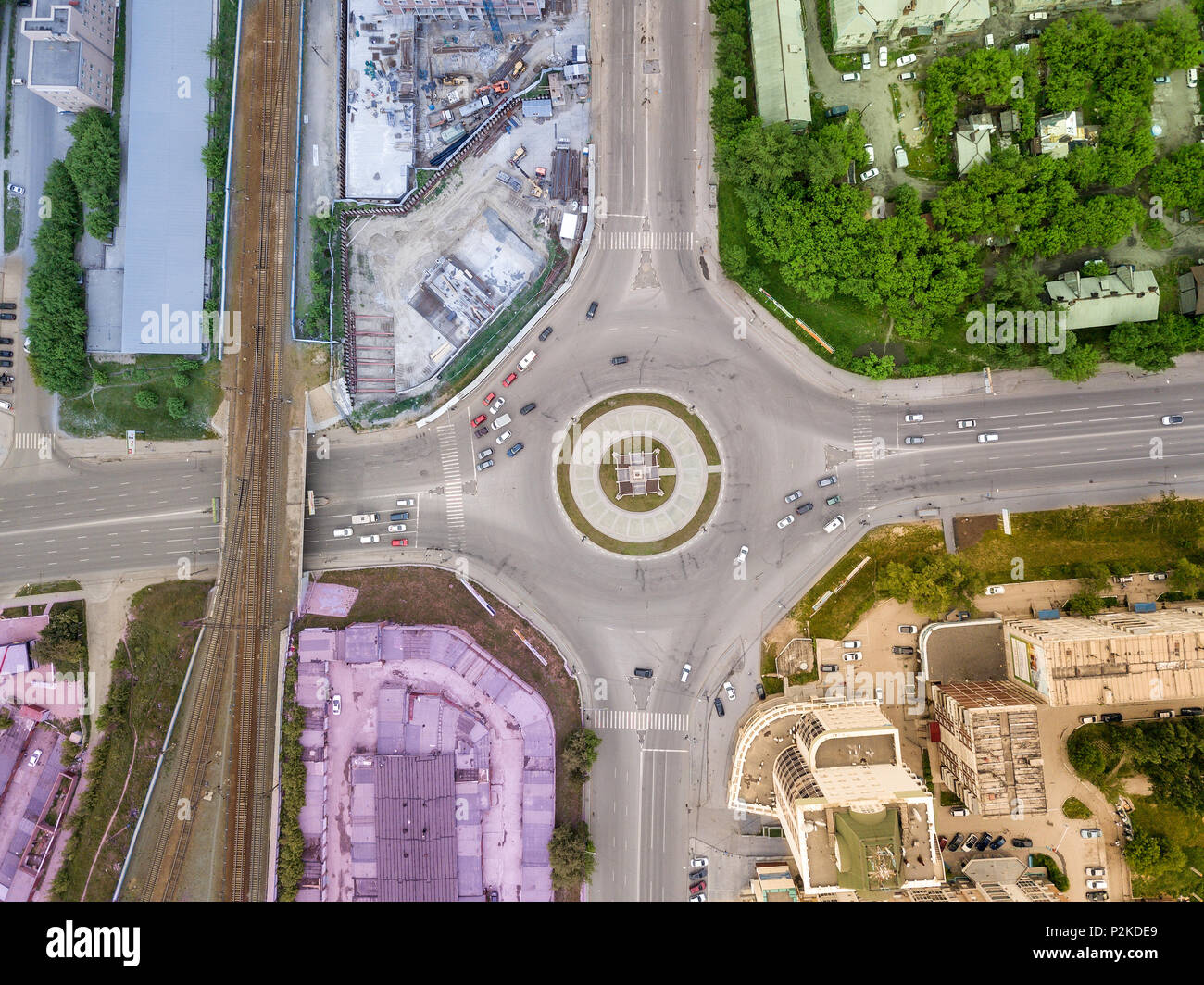 Aerial view of square in the city with roundabout traffic, streets and ...