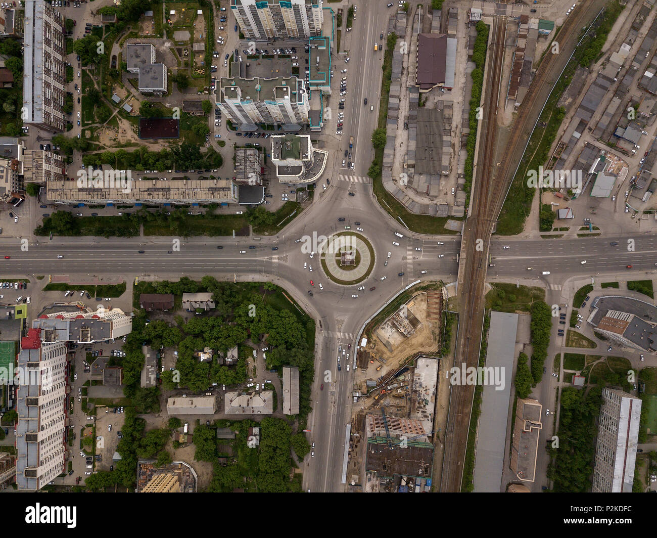 Aerial view of square in the city with roundabout traffic, streets and ...