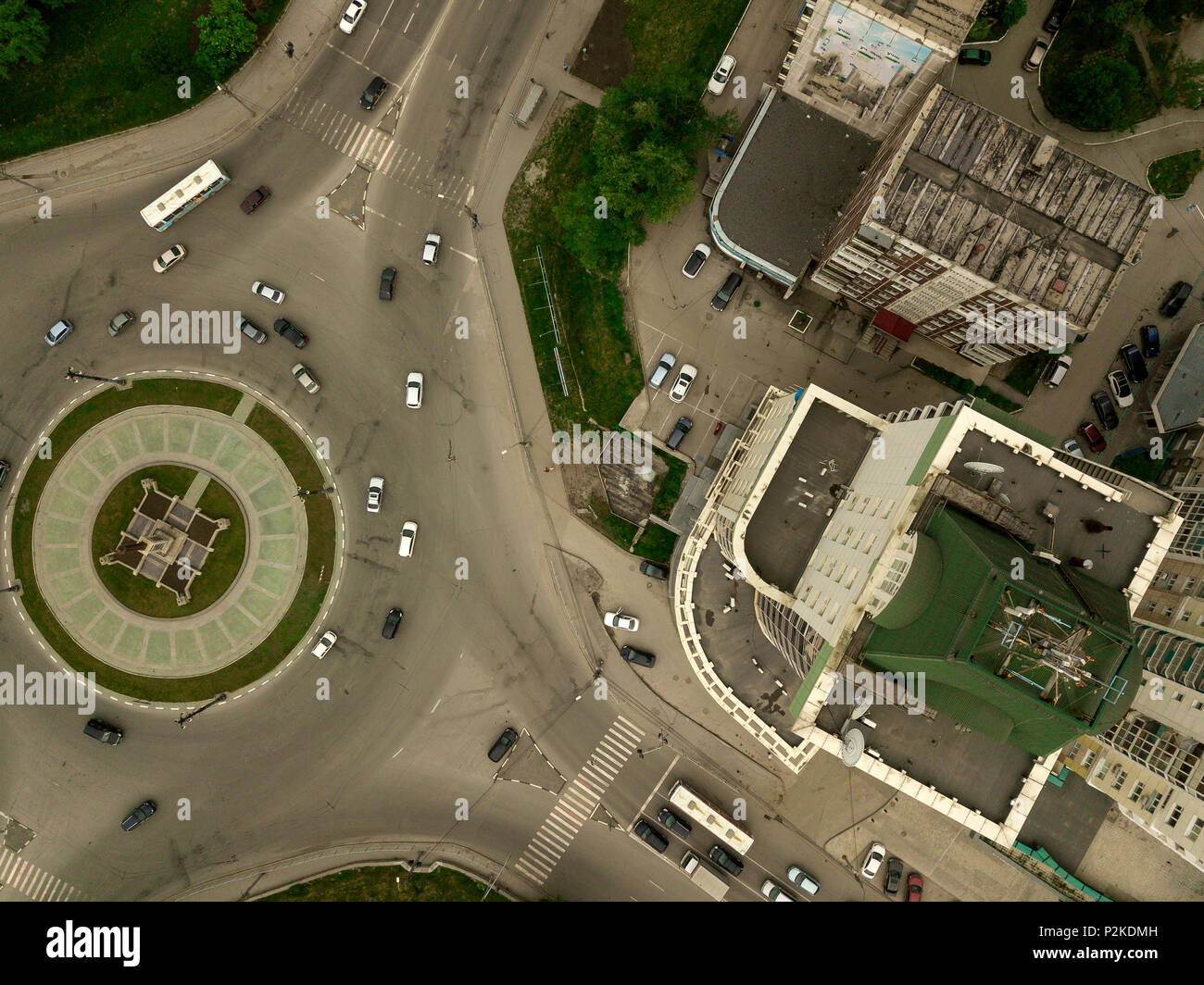 Aerial view of square in the city with roundabout traffic, streets and ...