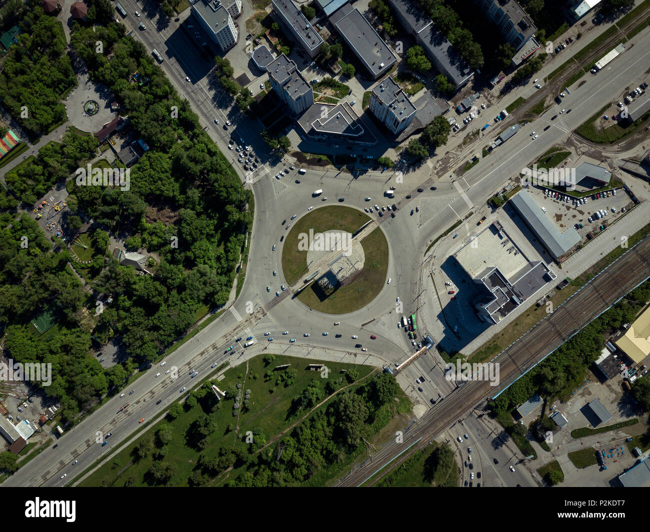 Aerial view of square in the city with roundabout traffic, streets and ...