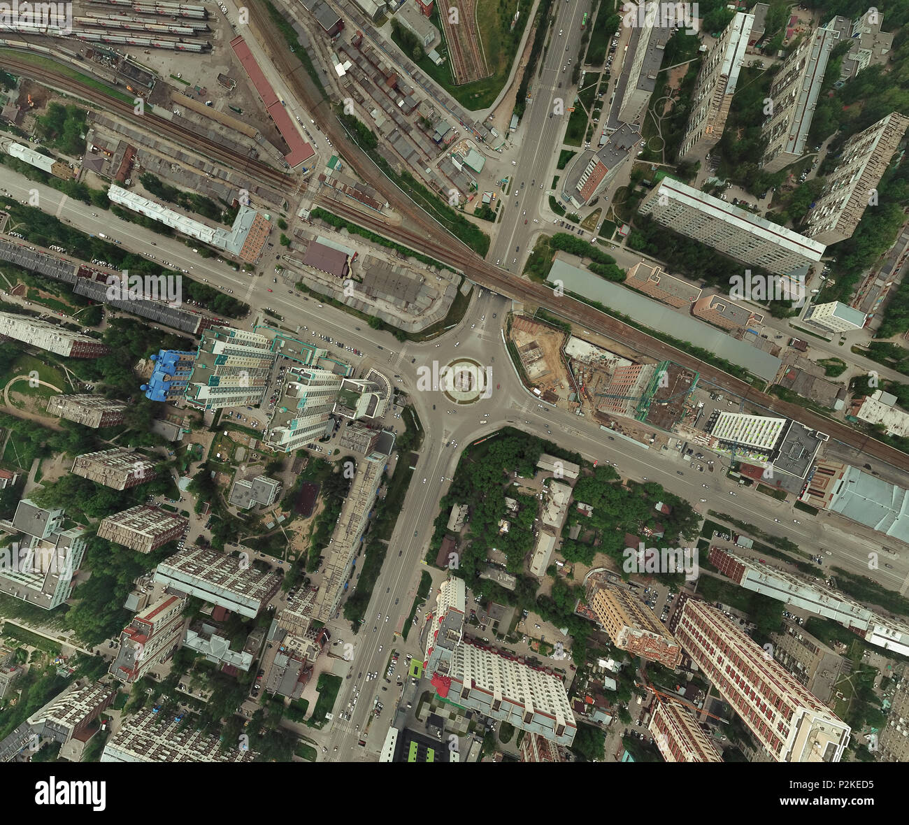 Aerial view of square in the city with roundabout traffic, streets and ...