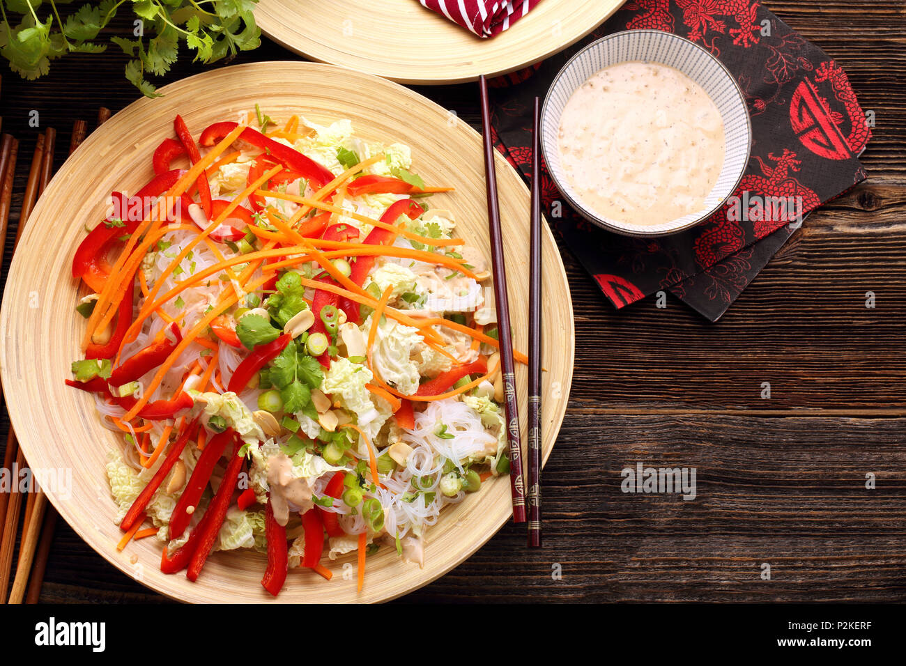 Asian salad with rice noodles and nuts Stock Photo - Alamy