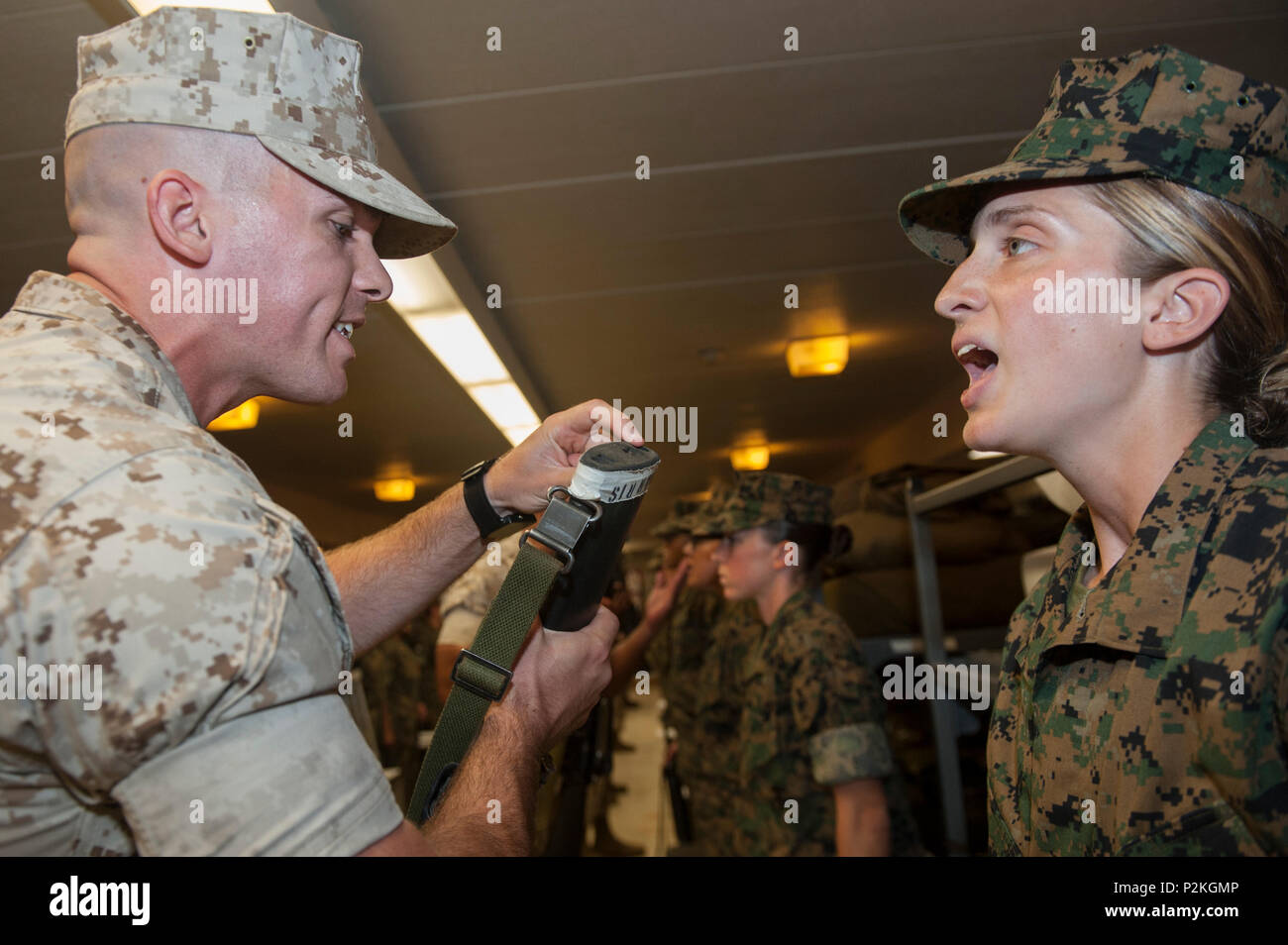 U.S. Marine Drill Instructor Staff Sgt. Daniel Horcharik inspects a ...