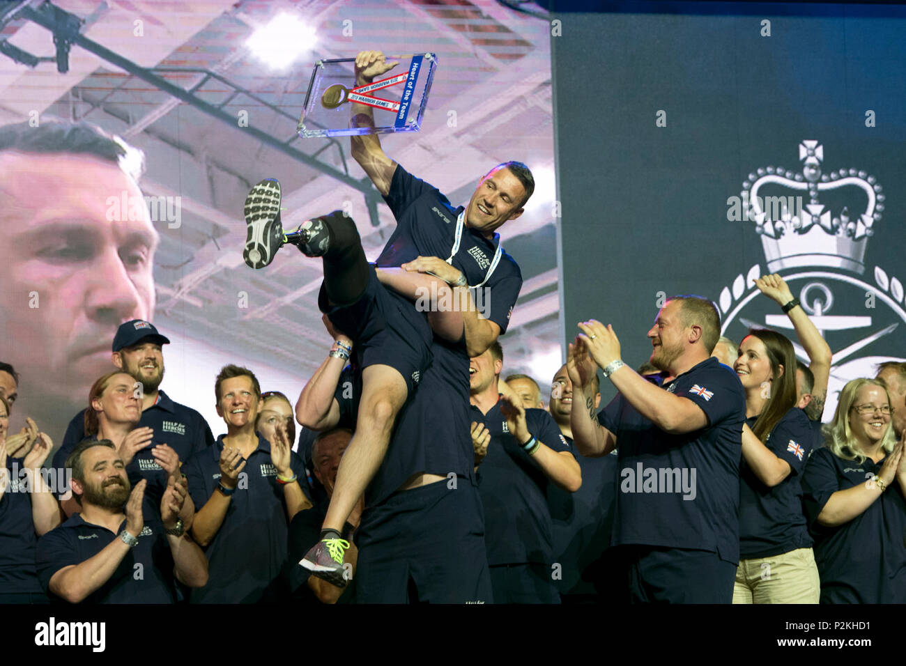 Team United Kingdom veteran Cpl. Michael Bates reacts to being lifted ...