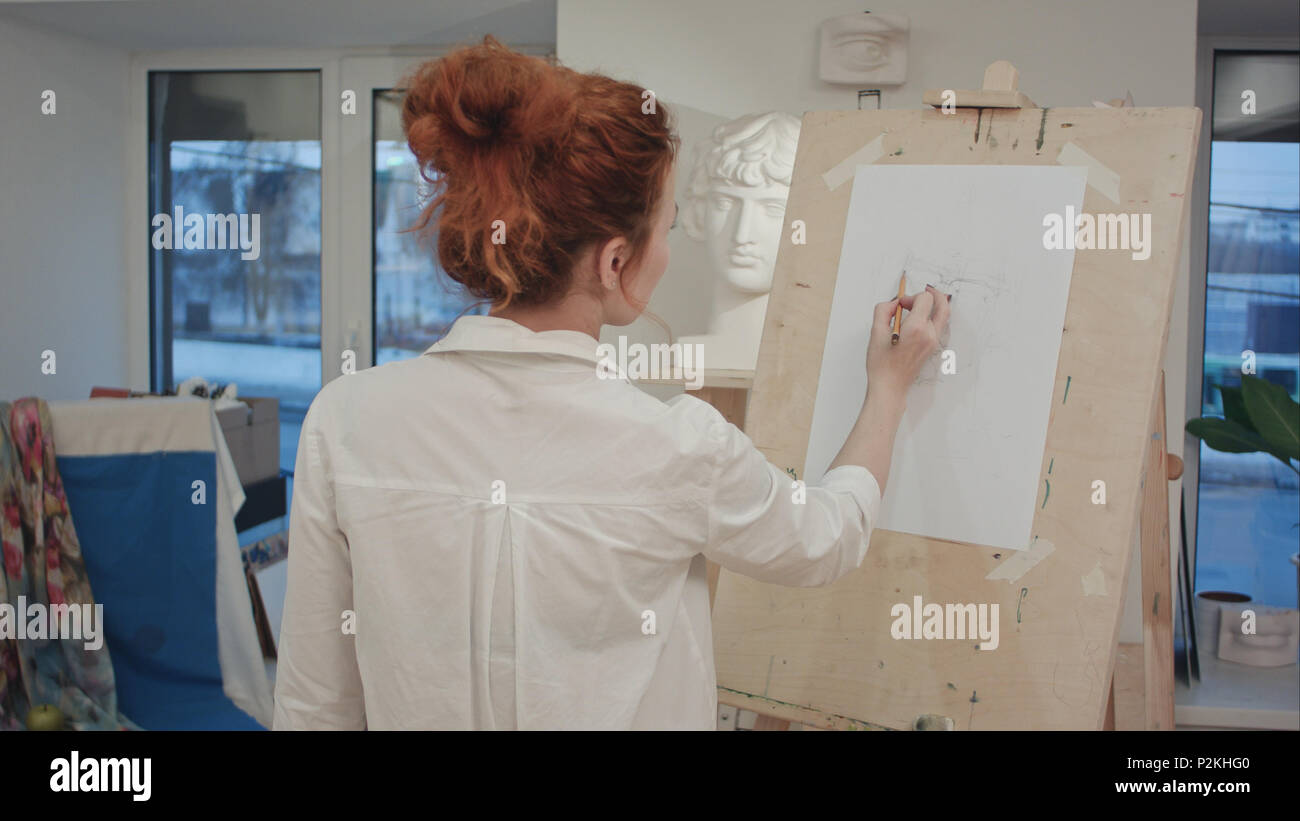 Female art student drawing plaster cast on easel Stock Photo - Alamy