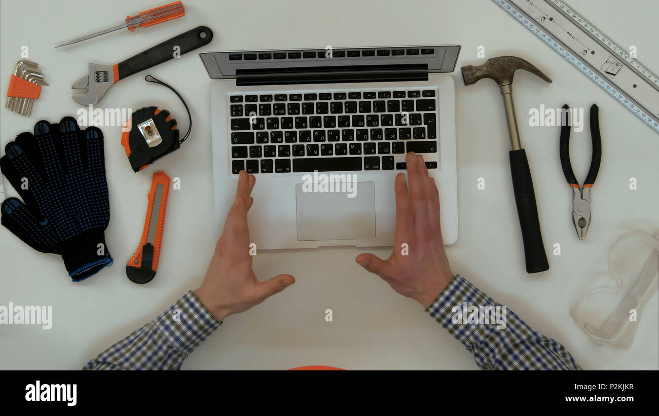 Engineer explaining technical drawing during video call on laptop Stock ...