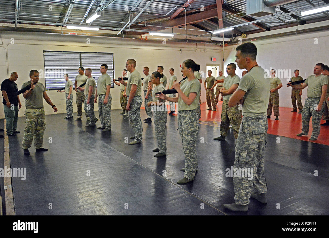 Two U.S. Army MPs from the 728th MP Battalion, 8th MP Brigade, 8th Theater Sustainment Command ...