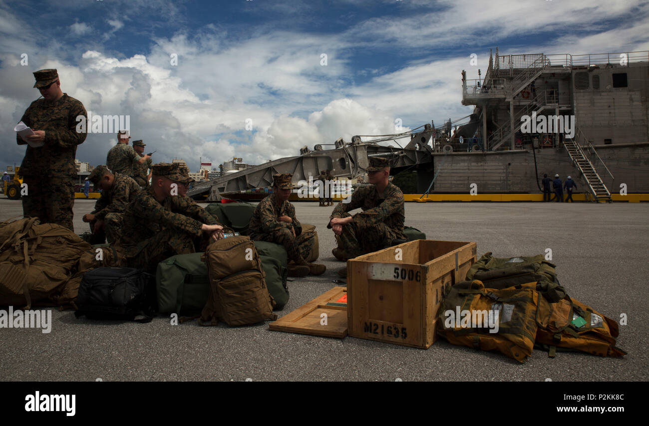 Marines with III Marine Expeditionary Force wait to board the USNS ...