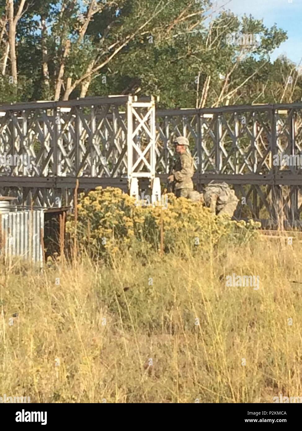 Soldiers from the 576 RCC's Equipment Platoon inspect a bridge for ...