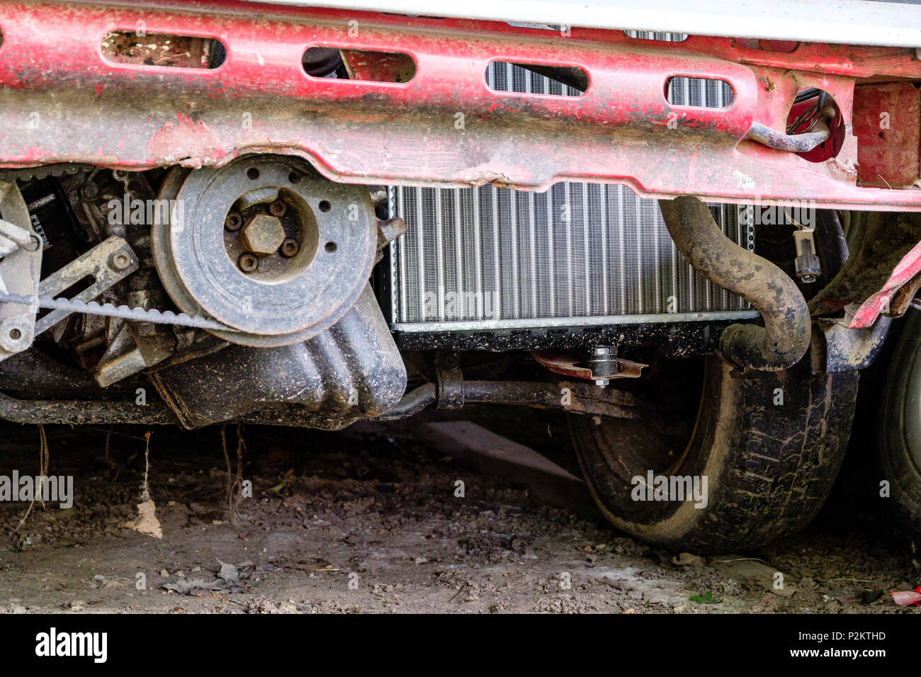 Detail of red tractor in countryside. engine parts and tires Stock ...