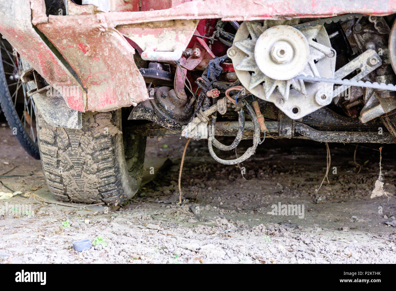 Detail of red tractor in countryside. engine parts and tires Stock ...