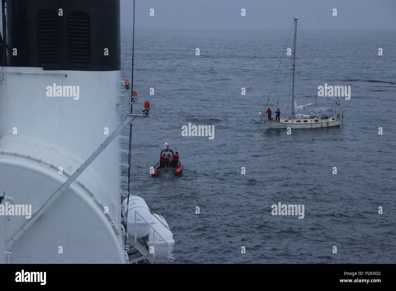 The crew of USCGC Morgenthau (WHEC-722) prepare to tow the 35-foot ...