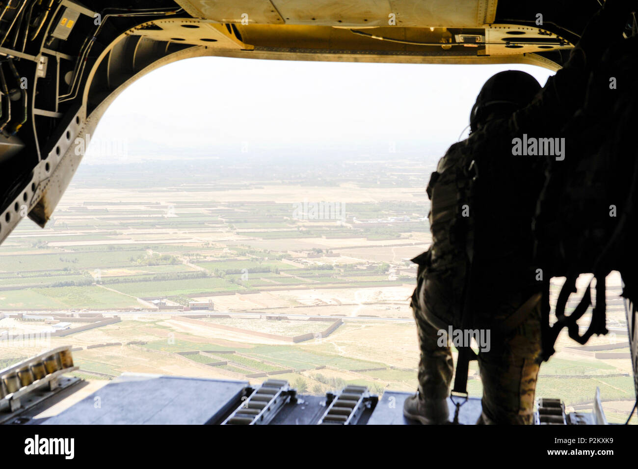 A U.S. Army Soldier provides observation and security out the back of a ...