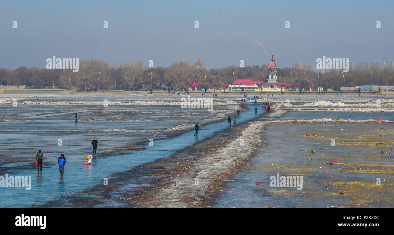 Harbin, China - Feb 22, 2018. People walking on Songhua ice river in ...