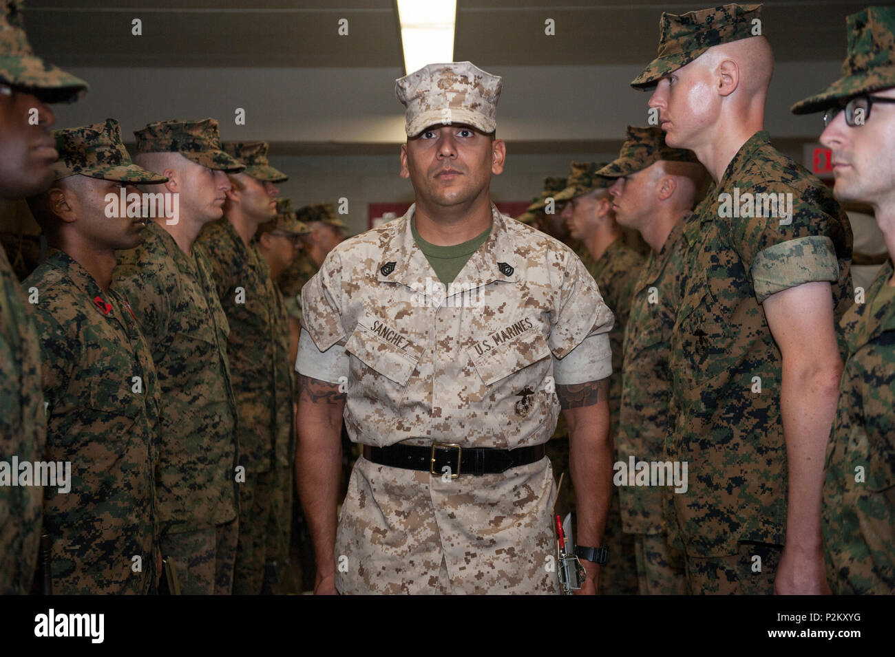 U.S. Marine Drill Instructor Gunnery Sgt. Rodney Sanchez inspects ...
