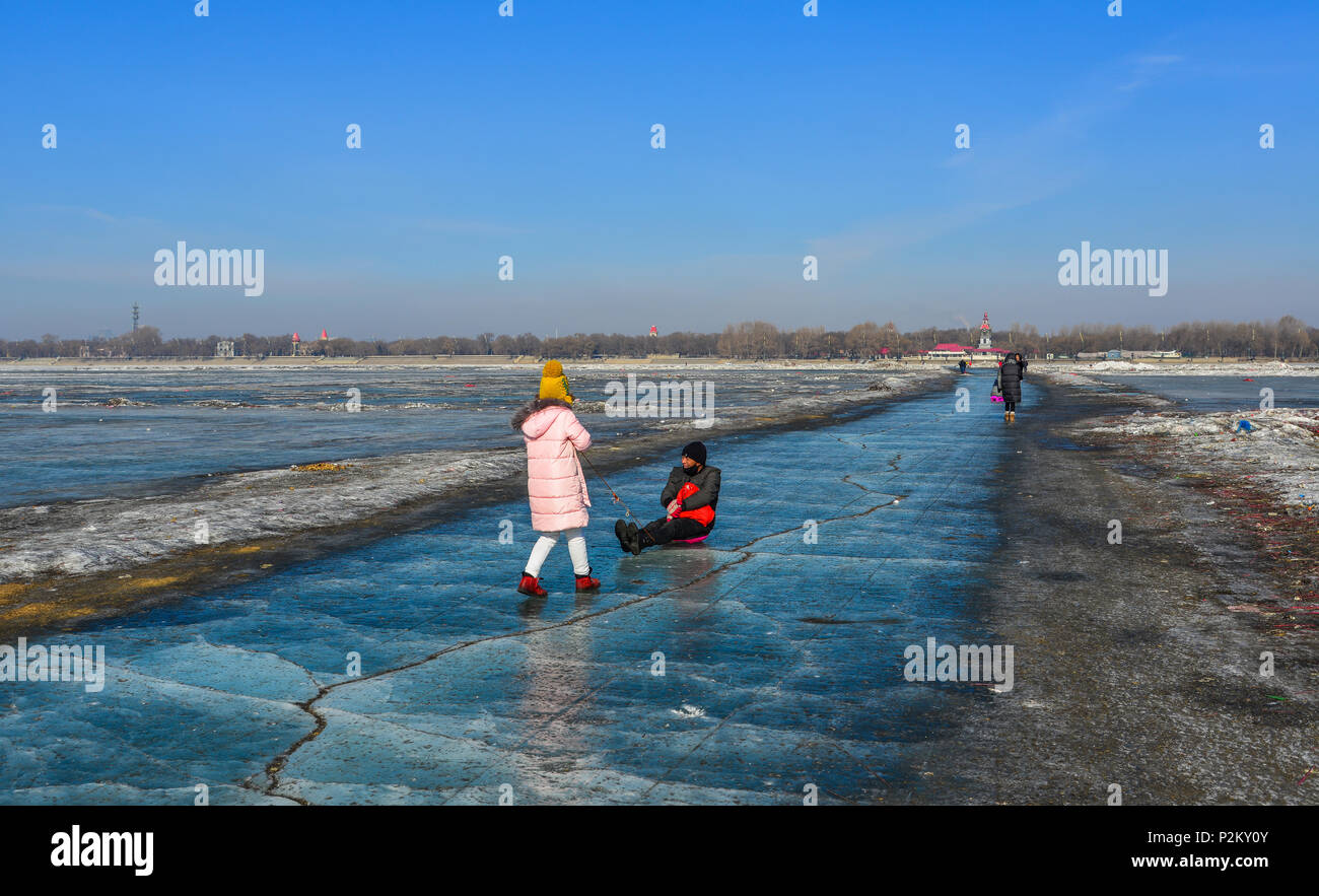 Harbin, China - Feb 22, 2018. People walking on Songhua ice river in ...