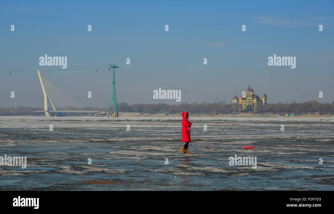 Harbin, China - Feb 22, 2018. People walking on Songhua ice river in ...